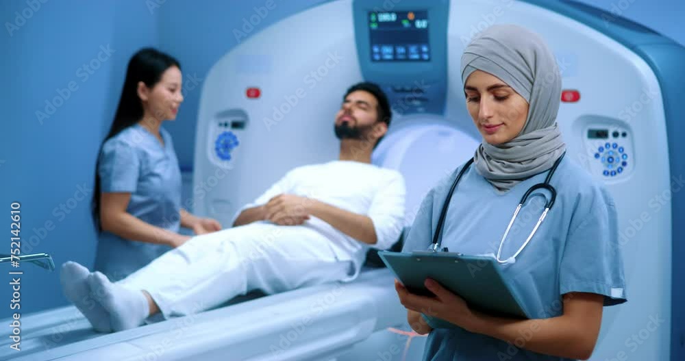 Vidéo Stock Arabian doctor with stethoscope holding folder. Muslim ...