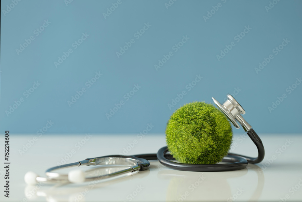 Environment Earth Day Concept.Green Earth with a medical doctor's ...