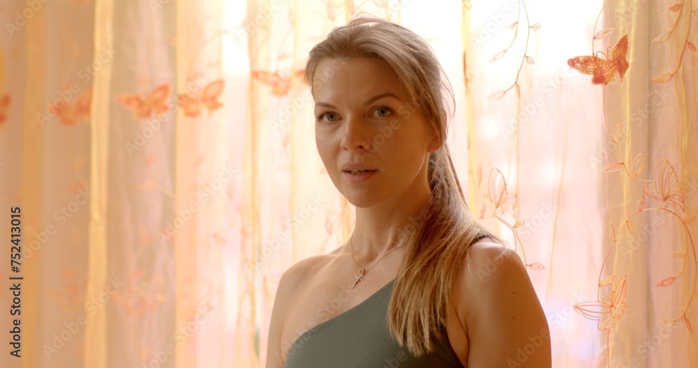 Morning home workout, a portrait of a woman perspiring, indicating the ...