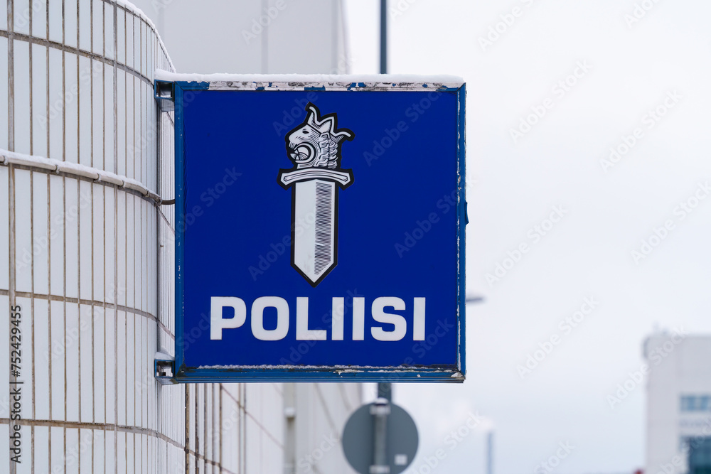 Sign with official finnish police logo and the word poliisi (police ...