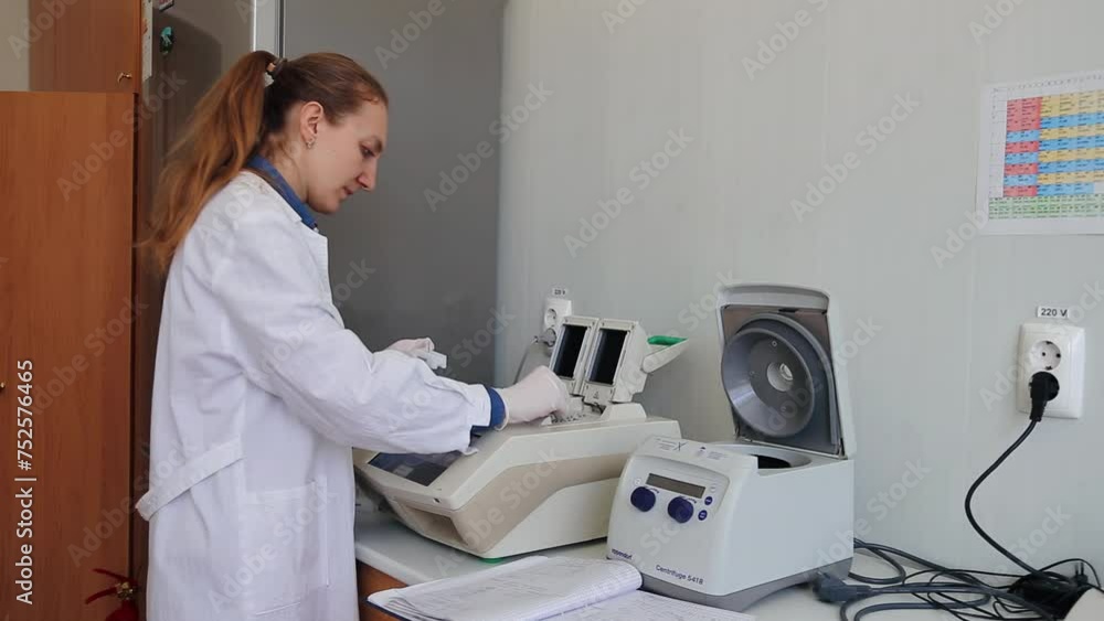 Female scientist with gloved hand putting DNA sample into real-time PCR ...