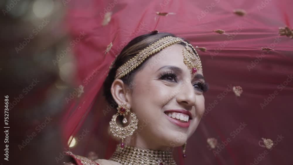 Beautiful Indian Bride With Her Red Traditional Veil Ghoonghat On ...