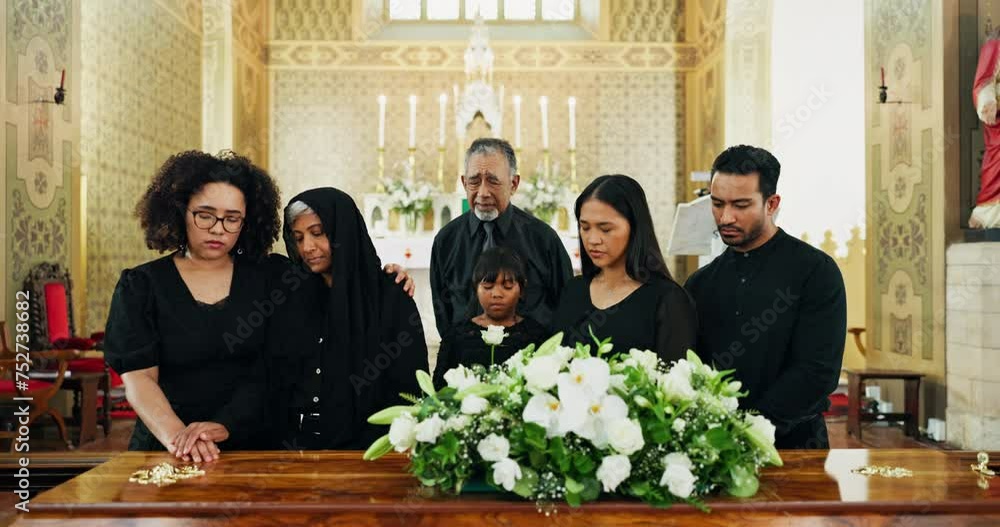 Funeral, family and child crying at coffin with flowers at memorial ...