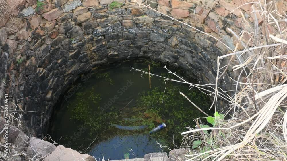 Old water well. It is common to see these wells in the fields of India ...