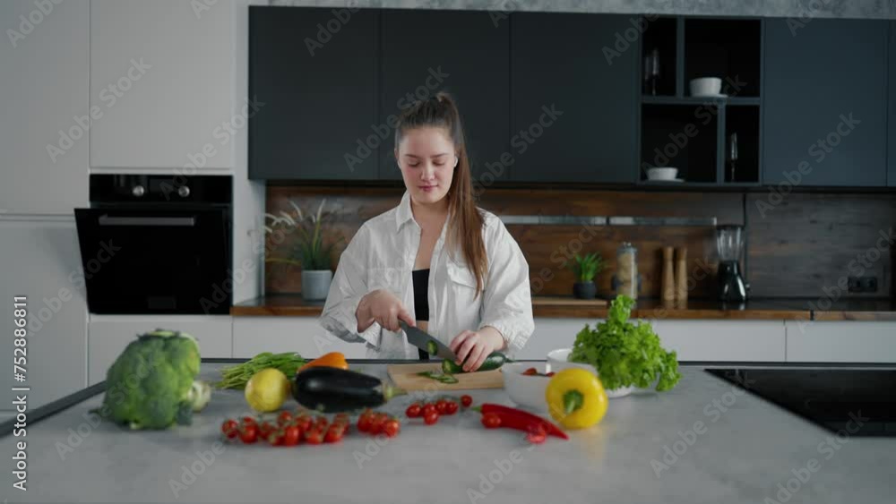 Vidéo Stock Young woman cooking, dancing at kitchen. Girl cook food ...