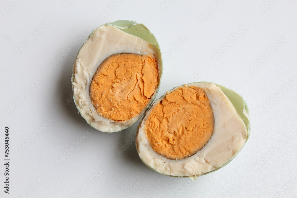 Halved salted egg, blue color shell from duck egg. Isolated on white ...