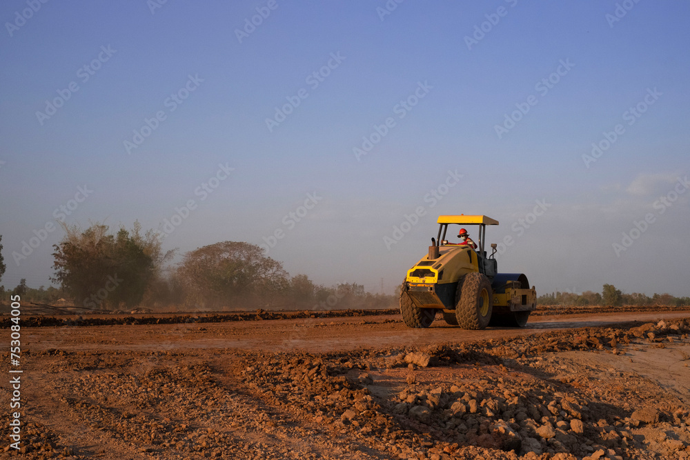 Soil compactor wheel roller is working. Road roller during highway ...