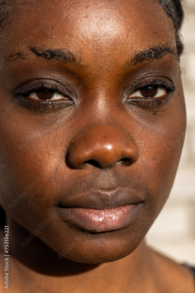 This is a close-up image focusing on the facial features of a young ...