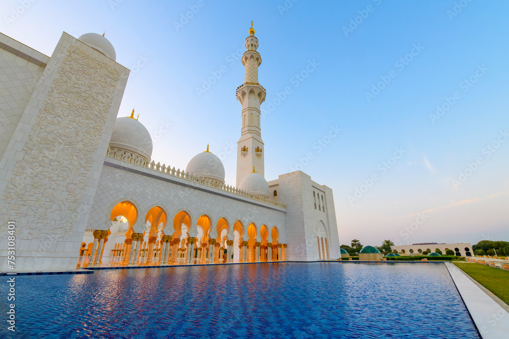 View of the domes and minaret from the exterior water feature pond ...