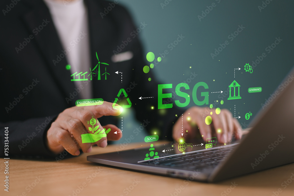 ESG environment social governance concept. Man use computer analyze ESG ...