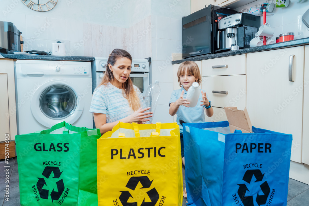 Mother is teaching kid how to recycle help the boy aware environmental ...