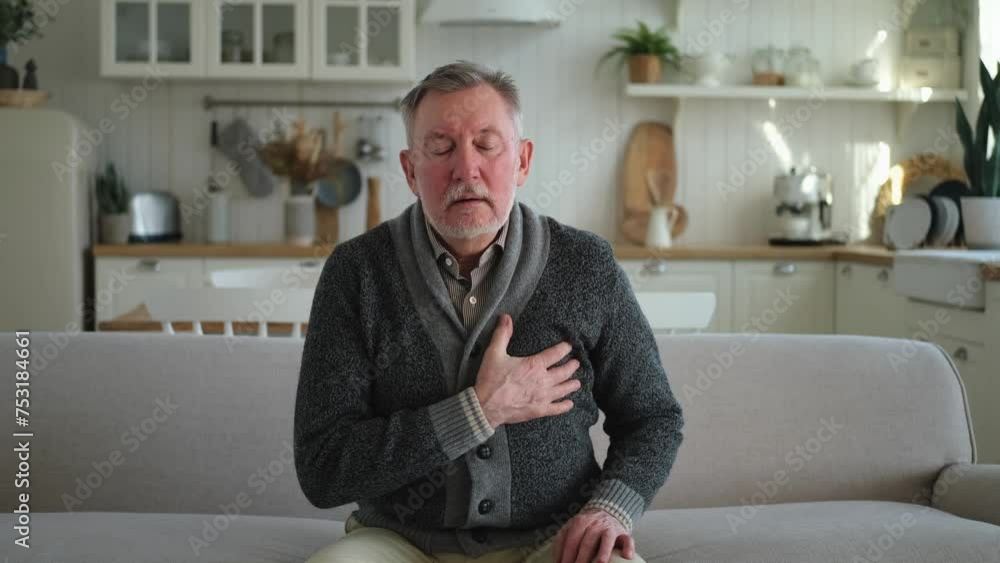 Pain on heart, heart attack. Unhappy middle aged senior man suffering ...