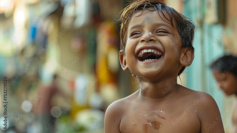 Joyful child laughing in a street setting - An exuberant young boy ...