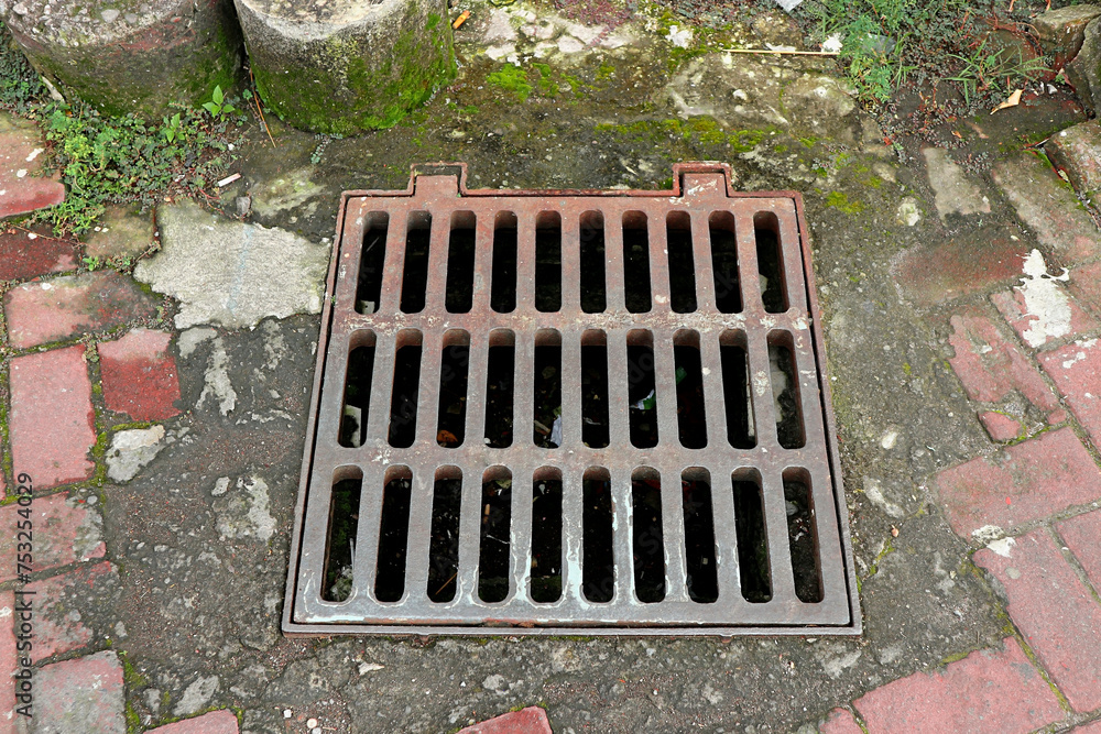 The city's drainage system is placed above ground, made of metal with a ...