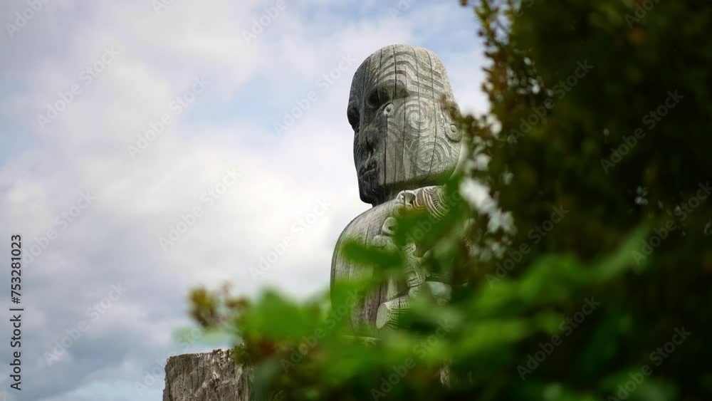 Maori statue at Wairakei Terraces in New Zealand. Silica terraces ...