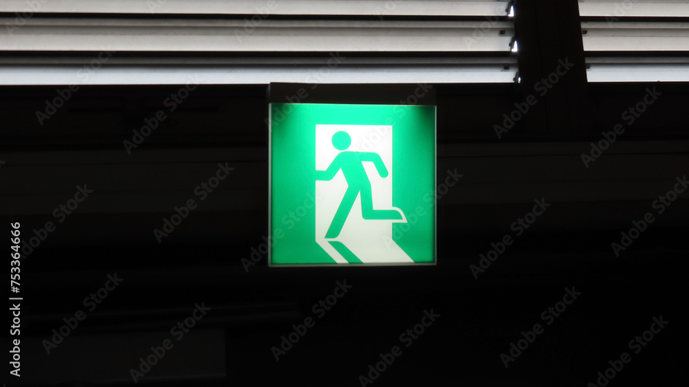 Emergency exit pictogram: emergency evacuation route in case of ...