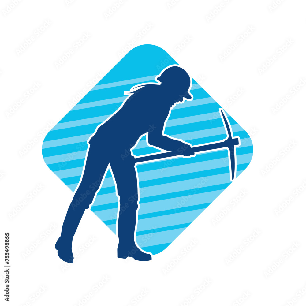 Silhouette of a woman in worker costume carrying pick axe tool in ...