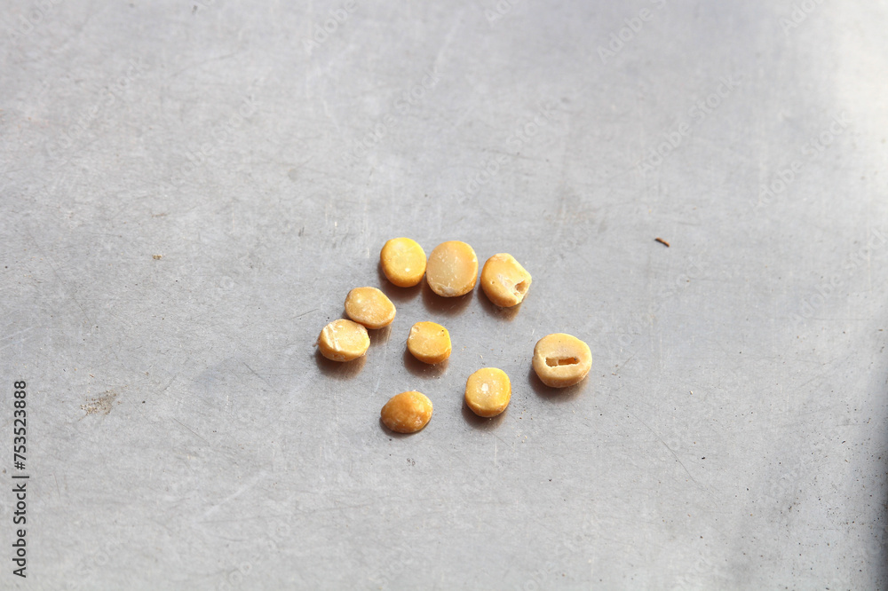 Some beans of tuwar dal or pigeon peas. Tuvar daal, also known as arhar ...