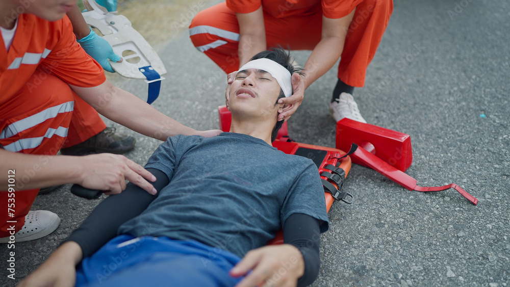 Team rescue helping victims injured in an accident using emergency bed ...