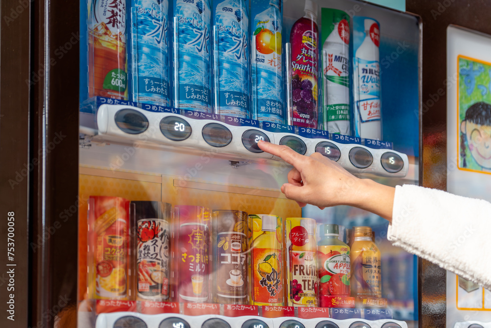 Osaka, Japan - November 23, 2023 - Woman using vending machine at Osaka ...