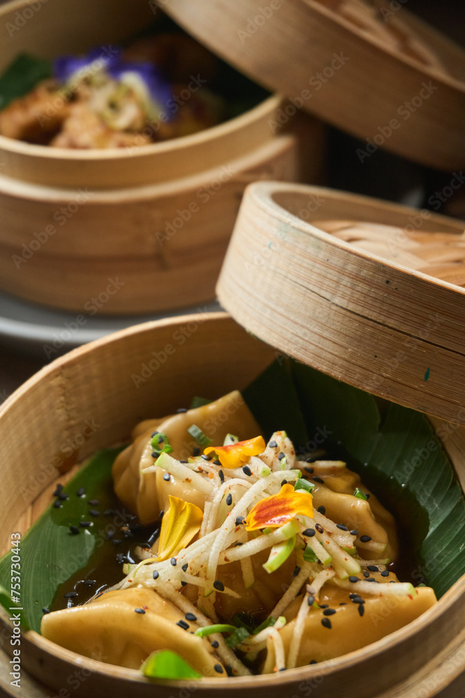 Group of delicious Japanese vegetable gyosas on a traditional bamboo ...