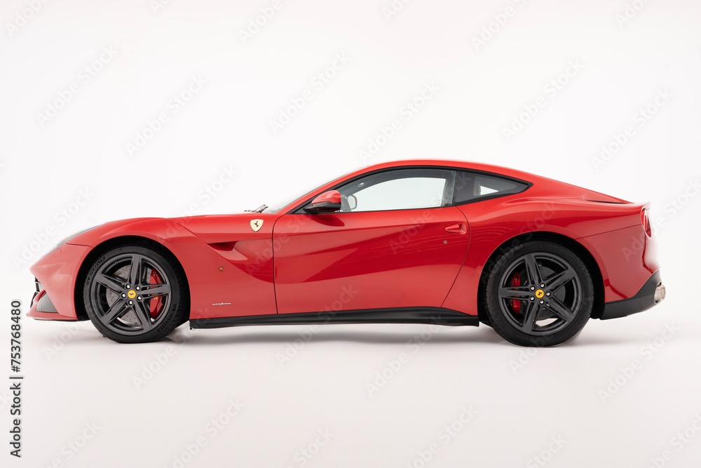 Red Ferrari F12 Berlinetta side view isolated on white background ...