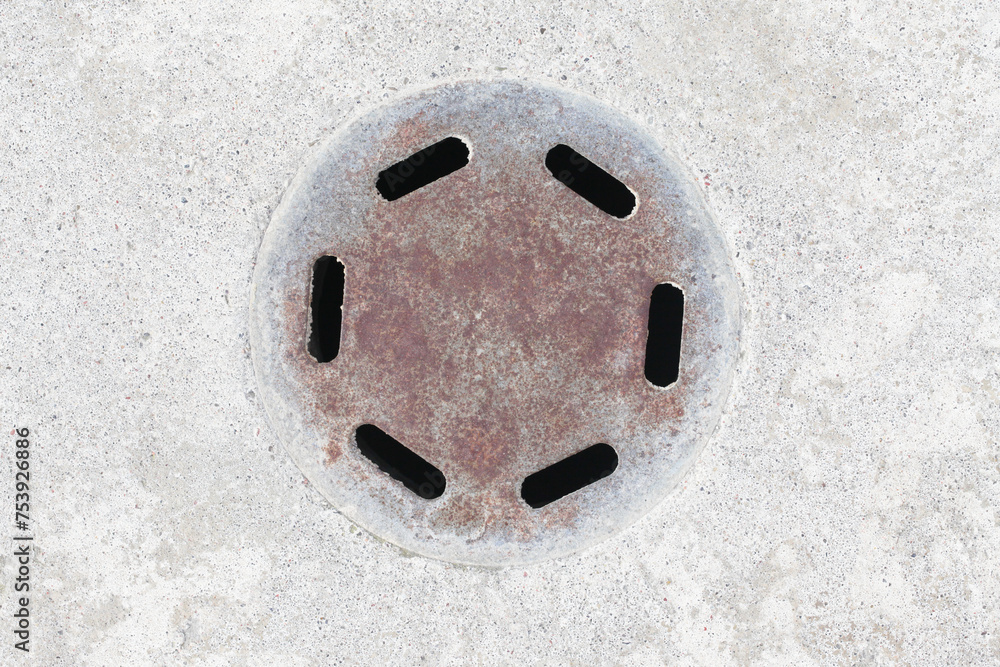 Round manhole on concrete drain system cover. Urban sewer background ...