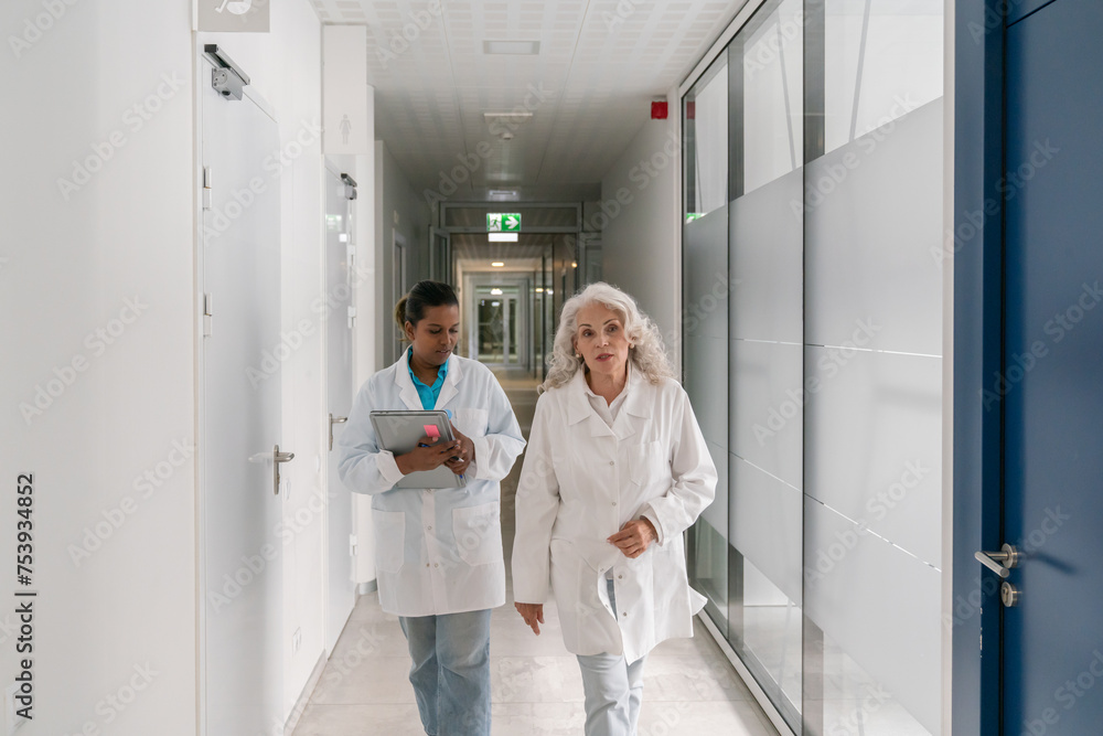 Scientists Walking At Corridor In Modern Science Centre Stock Photo ...