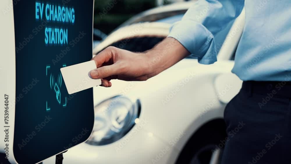 Businessman pay electric vehicle's eco-friendly and sustainable energy ...