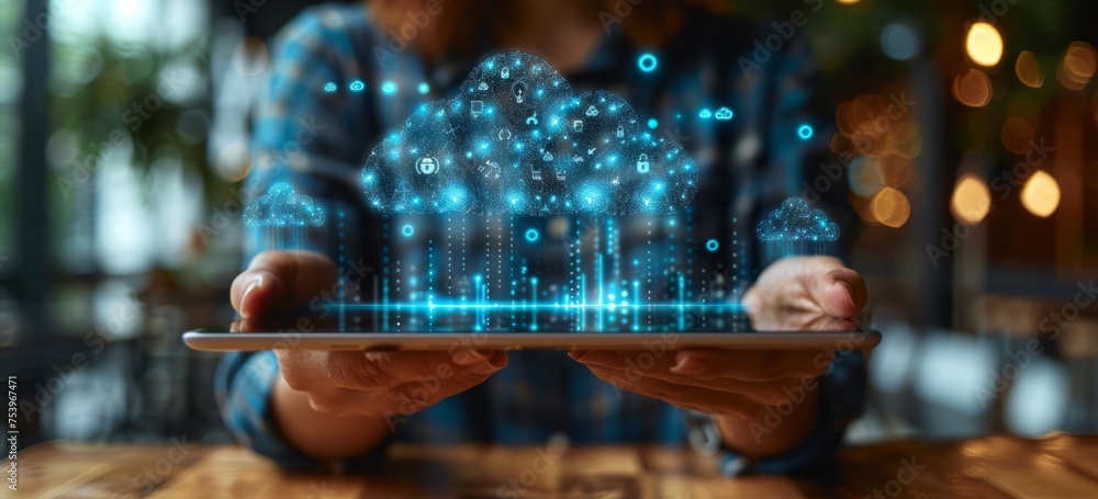 A person holds an iPad with digital safety symbols floating above the ...