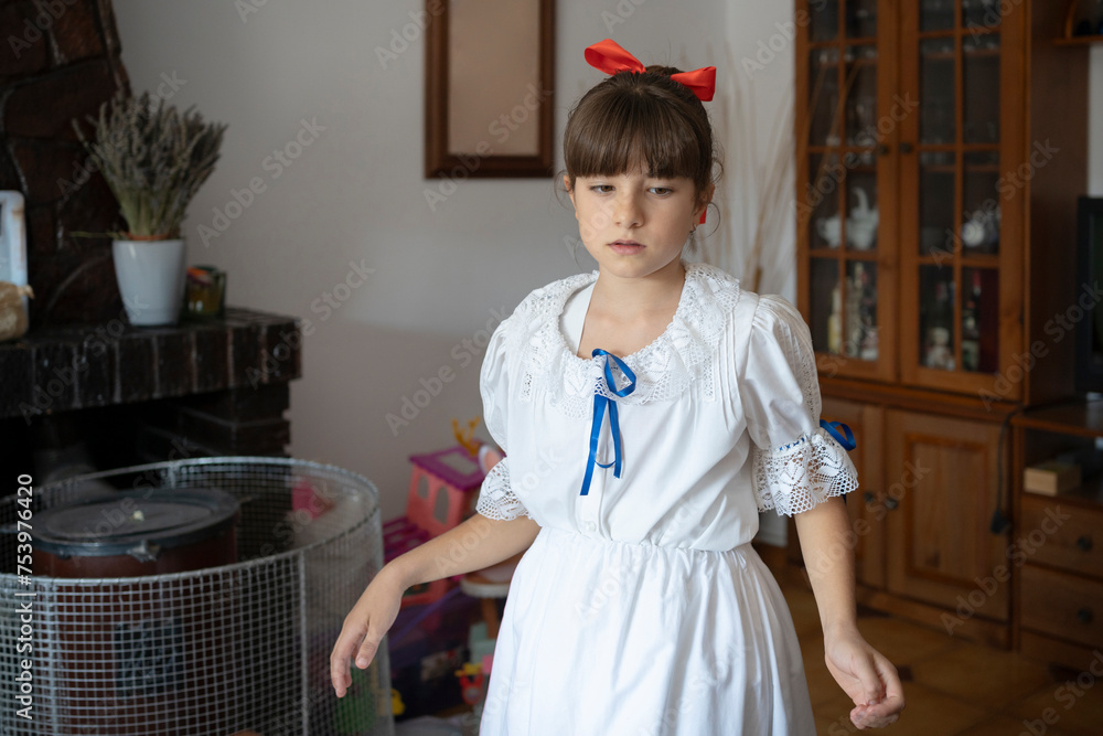 Happy preteen girl in traditional dress Stock Photo | Adobe Stock