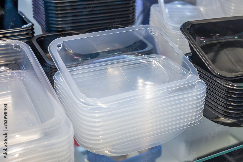 Stacks of plastic food trays for packaging and transporting takeaway ...