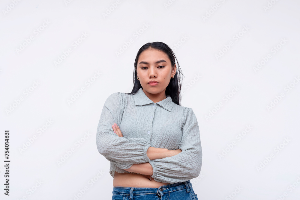 Portrait of a young Asian woman winking with a look of disappointment ...