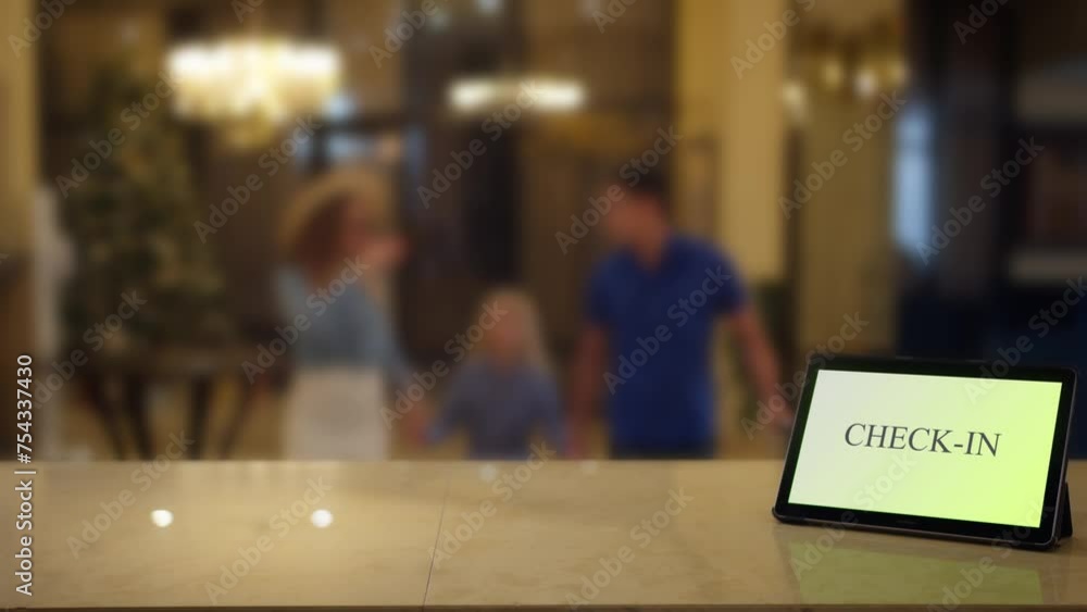 Receptionist using display with chroma key template with check-in word ...