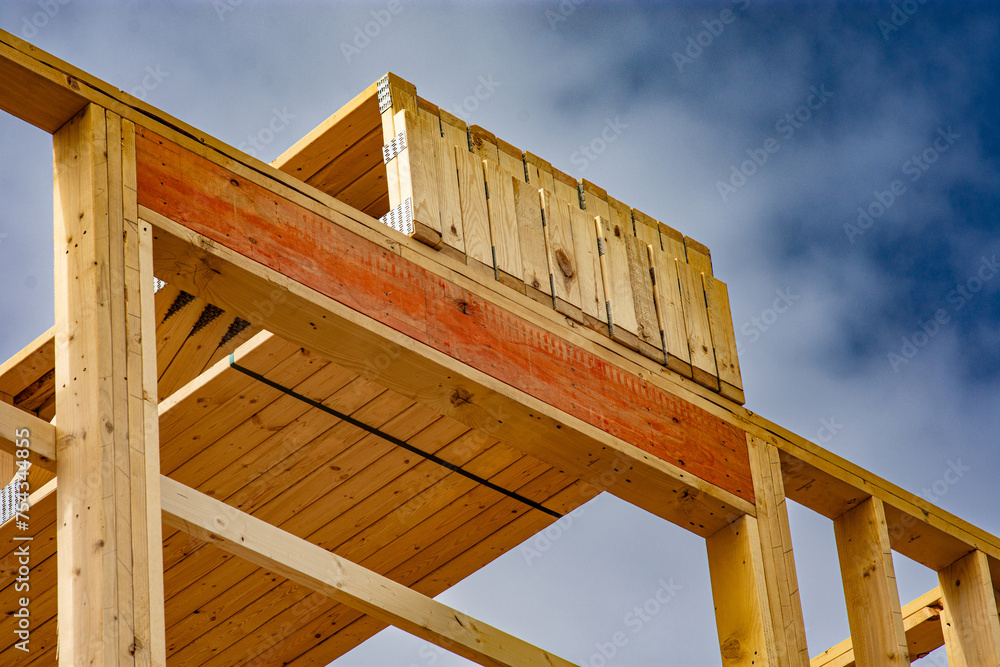 Floor joists stacked on top of first floor of multi story wood frame ...