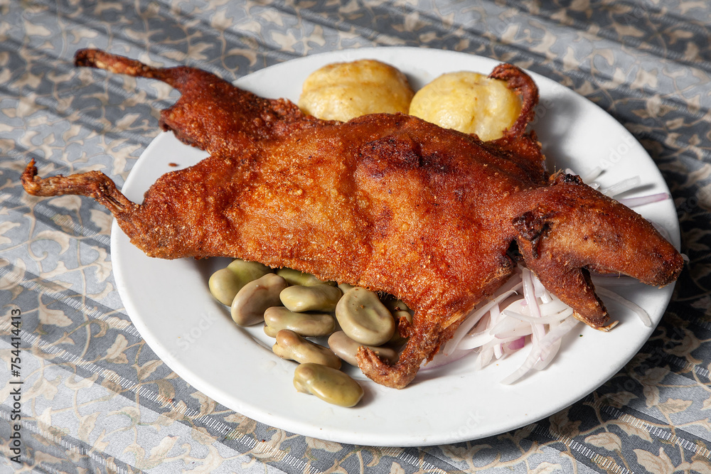Peruvian Cuy Chactado is a traditional dish that features guinea pig, a ...