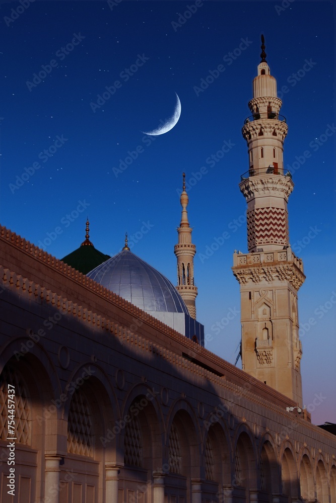 A mosque with the full moon in the sky. Masjid nabi of Medina, mosque ...