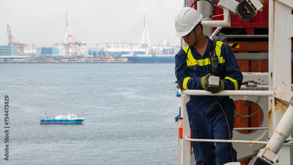 Seaman crew member of cargo vessel equipped with personal protective ...