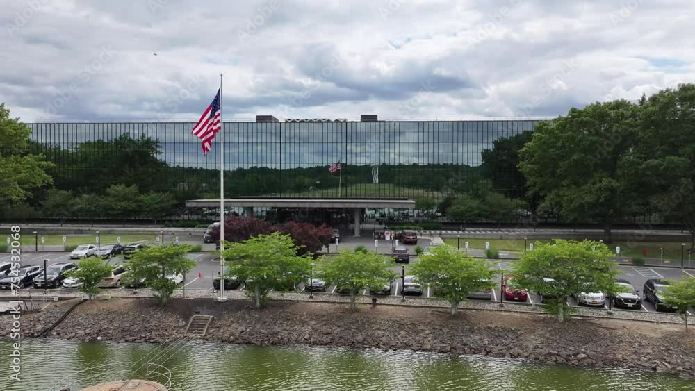 Patriotic Scene: American Flag Waving in Front of Corporate Office ...