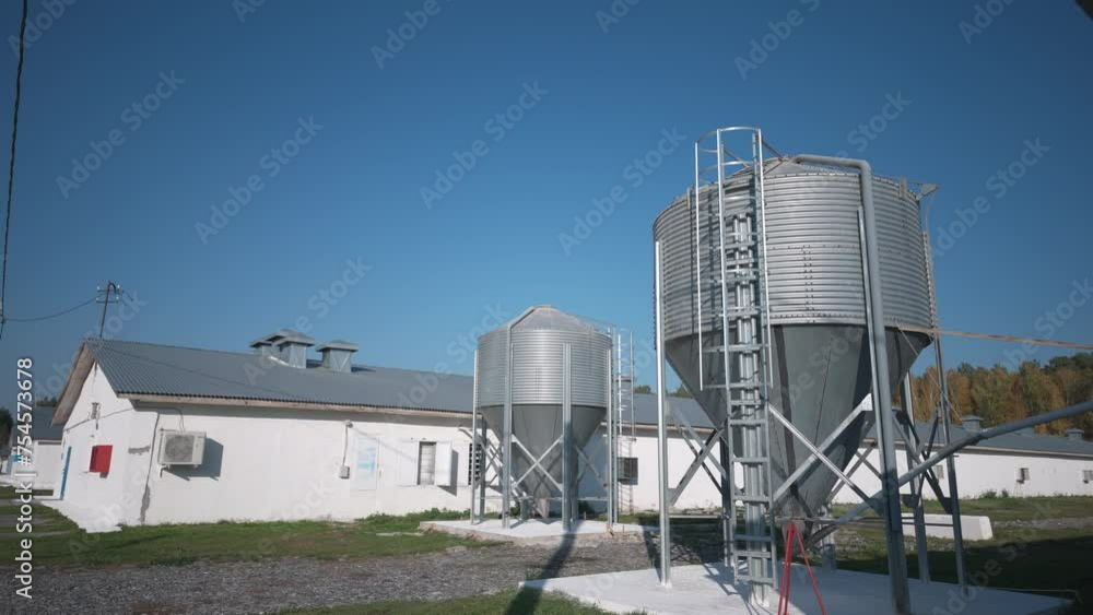 Two silo towers used for storage of food for animals at the farming ...