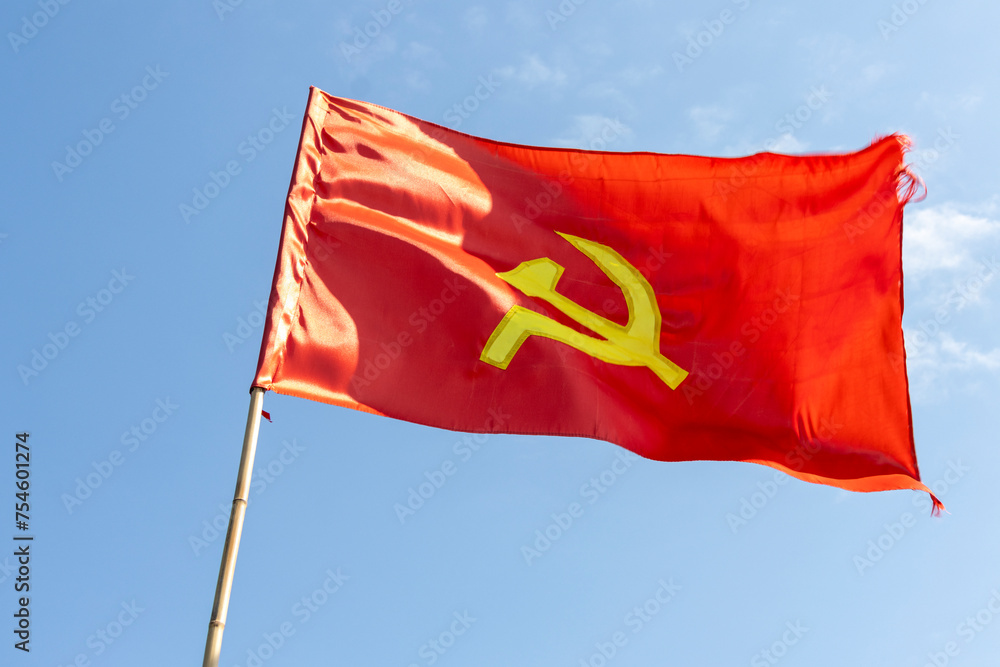 Photo & Art Print Large communist flag floating in the wind with a blue ...