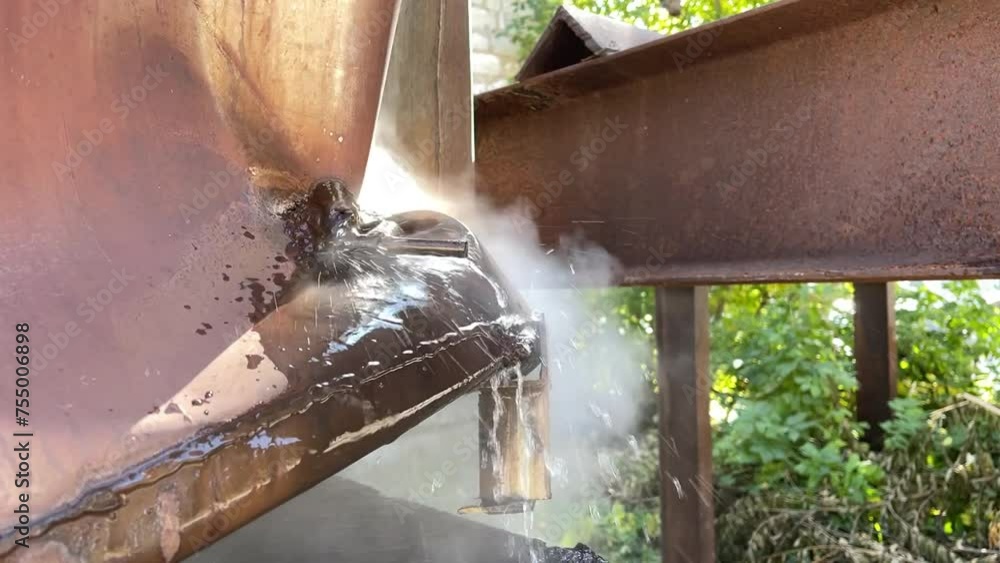 Steam outlets from hole in old hot water tank tank, Hot evaporation ...