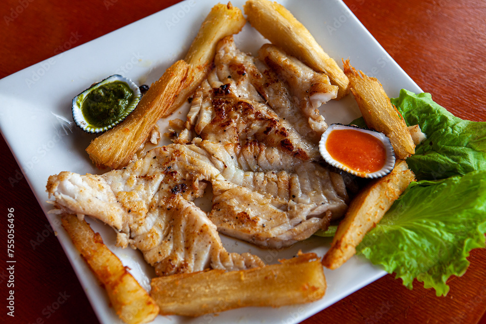 Peruvian grilled fish, or "pescado a la parrilla" in Spanish, is a ...