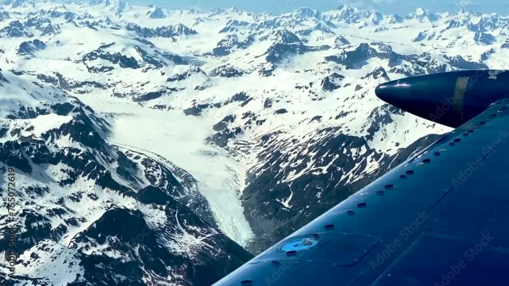 Glacier seen from small airplane in Lake Clark Pass, Alaska. Dark ...