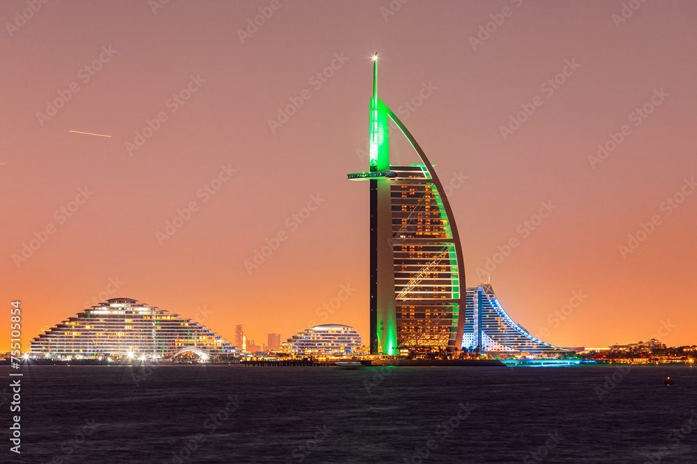Burj Al Arab building at night seen from Palm Jumeirah island in Dubai ...