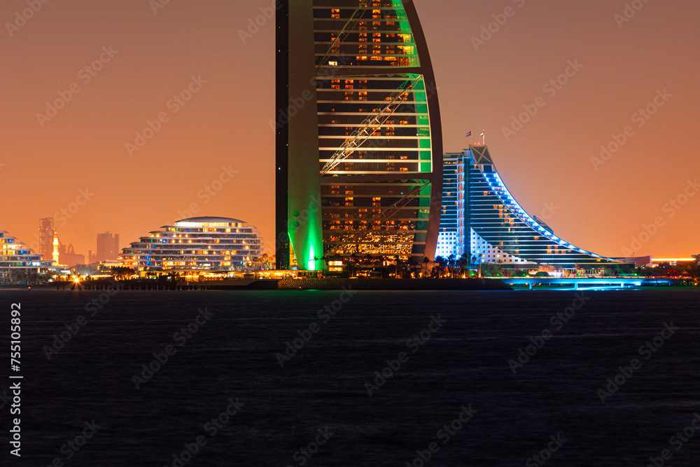 Burj Al Arab building at night seen from Palm Jumeirah island in Dubai ...