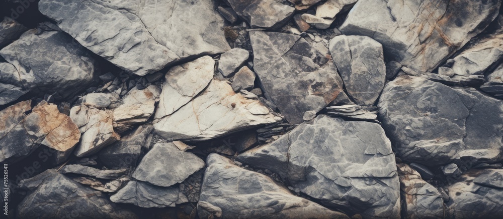 A cluster of rocks is tightly packed together, creating a natural ...