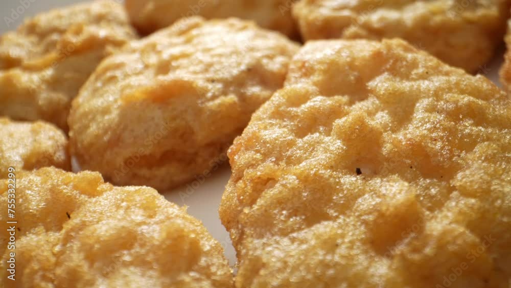 Chicken nuggets: bite-sized chicken, breaded, fried and baked till ...