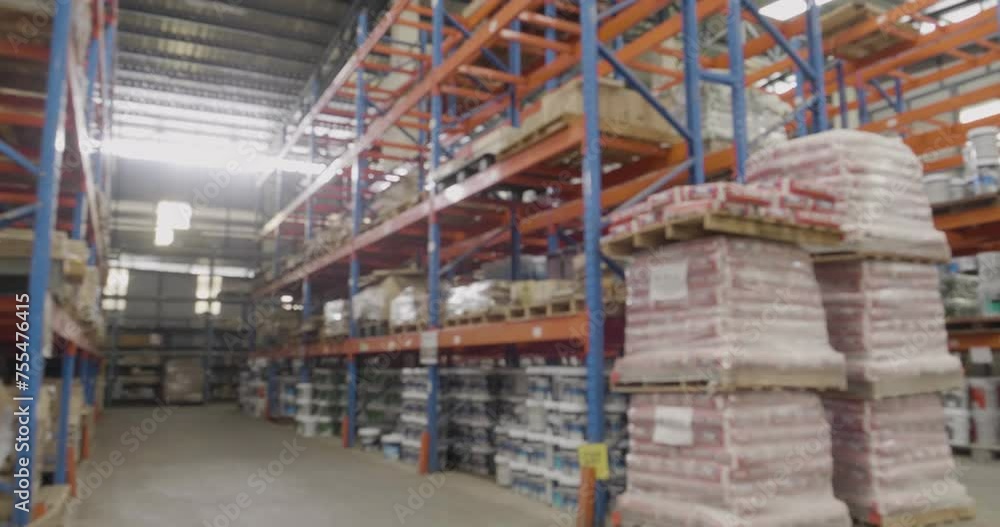 Blurred Background Commercial packaging on steel rack. Aisle in ...