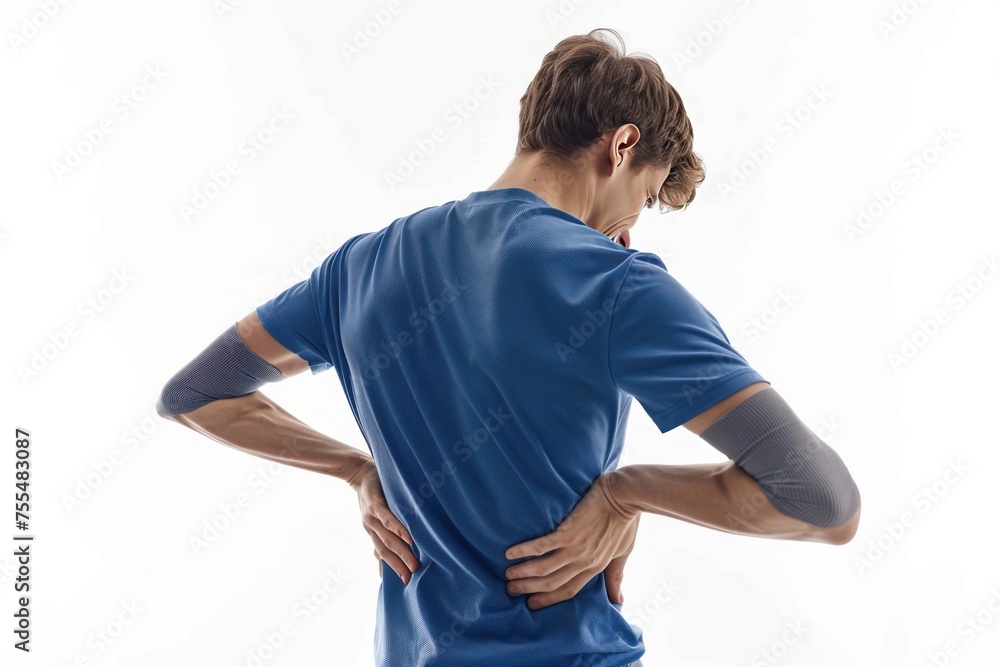 A man with a blue t shirt is bending over and rubbing his back. Concept ...